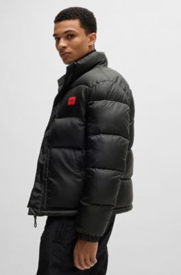 HUGO - Water-repellent puffer jacket with red logo label - Black