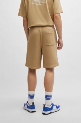 HUGO - Loose-fit shorts in cotton terry with logo print - Beige