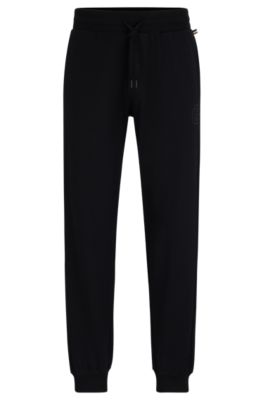 BOSS - Cuffed tracksuit bottoms in cotton terry with double monogram
