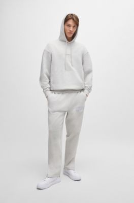 HUGO - Loose-fit cotton-terry tracksuit bottoms with outline logo ...