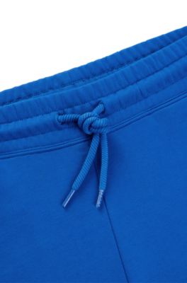 HUGO - Loose-fit cotton-terry tracksuit bottoms with outline logo - Blue