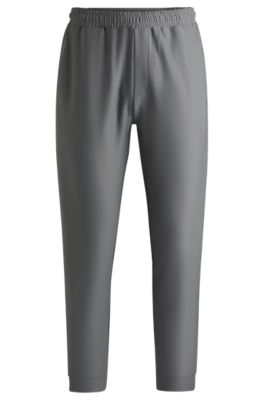 BOSS - Tracksuit bottoms in stretch fabric with decorative reflective logo