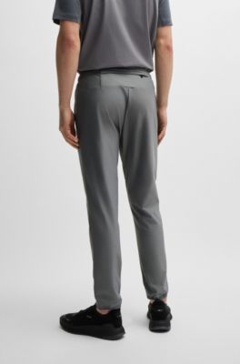 BOSS - Tracksuit bottoms in stretch fabric with decorative reflective logo