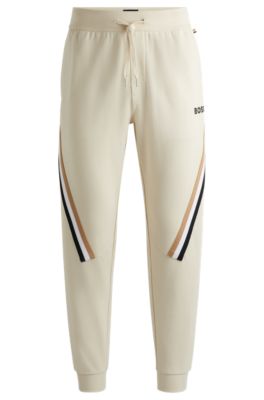 BOSS - Cotton-terry tracksuit bottoms with signature-stripe tape