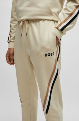 BOSS - Cotton-terry tracksuit bottoms with signature-stripe tape