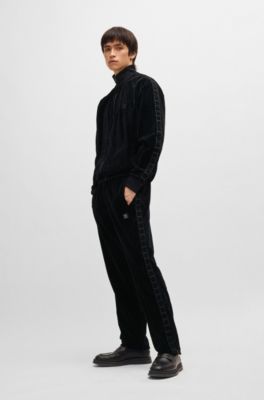 HUGO - Relaxed-fit velvet tracksuit bottoms with signature chain ...
