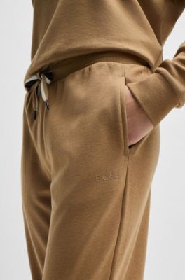BOSS - Cuffed tracksuit bottoms with signature-stripe drawcord - Light ...