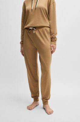 BOSS - Cuffed tracksuit bottoms with signature-stripe drawcord - Light ...