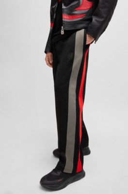 HUGO - HUGO x RB oversized-fit trousers with tape and signature bull ...