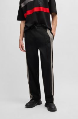 HUGO - HUGO x RB oversized-fit trousers with tape and signature bull ...