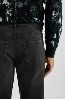 BOSS - Tapered-fit jeans in black super-stretch denim - Black