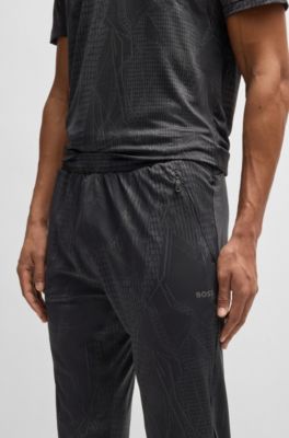 BOSS - Active patterned tracksuit bottoms in four-way stretch fabric ...