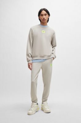 HUGO - Cotton-terry tracksuit bottoms with red logo label - Light Grey