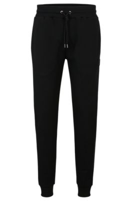 BOSS - Tracksuit bottoms with logo badge - Black
