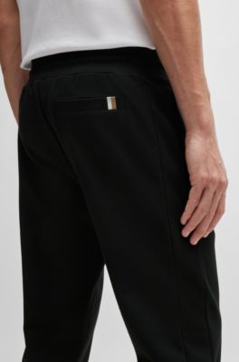 BOSS - Tracksuit bottoms with logo badge - Black