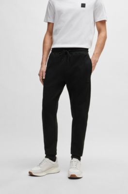 BOSS - Tracksuit bottoms with logo badge - Black