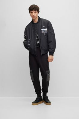 HUGO - Cotton-jersey T-shirt with graffiti-inspired artwork - Black