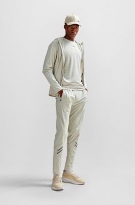 BOSS - Regular-fit tracksuit bottoms with decorative reflective artwork ...