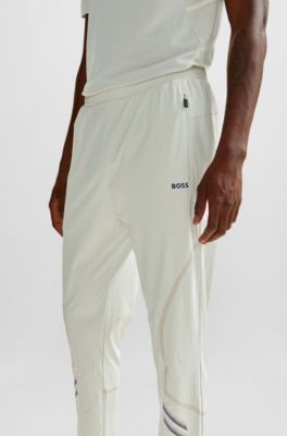 BOSS - Regular-fit tracksuit bottoms with decorative reflective artwork ...