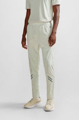 BOSS - Regular-fit tracksuit bottoms with decorative reflective artwork ...