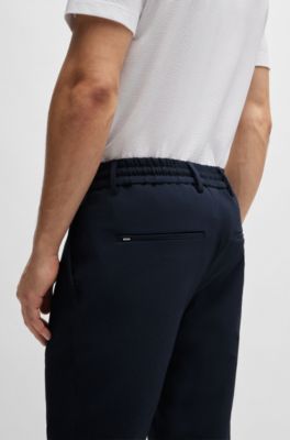 BOSS - Pantalones slim fit en tela bielástica - Azul oscuro