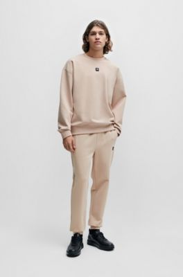 HUGO - Stretch-cotton tracksuit bottoms with stacked logo - Beige