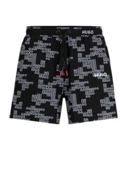 HUGO - Fully lined swim shorts with all-over logos