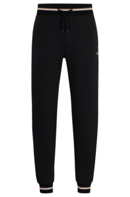 BOSS - Cotton-terry tracksuit bottoms with logo in signature colors - Black
