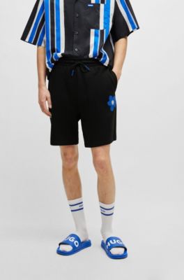 HUGO - Cotton-terry shorts with floral logo artwork - Black