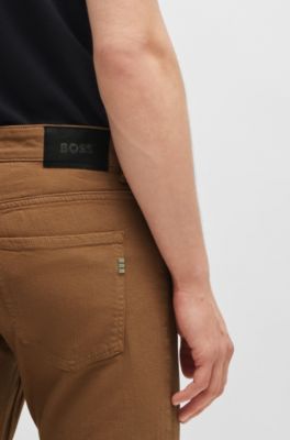 BOSS - Slim-fit jeans in black mechanical-stretch denim - Light Beige