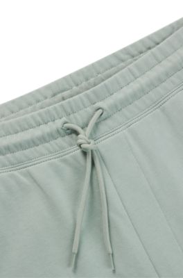 HUGO - Cotton-terry shorts with blue logo patch - Light Green