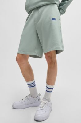 HUGO - Cotton-terry shorts with blue logo patch - Light Green